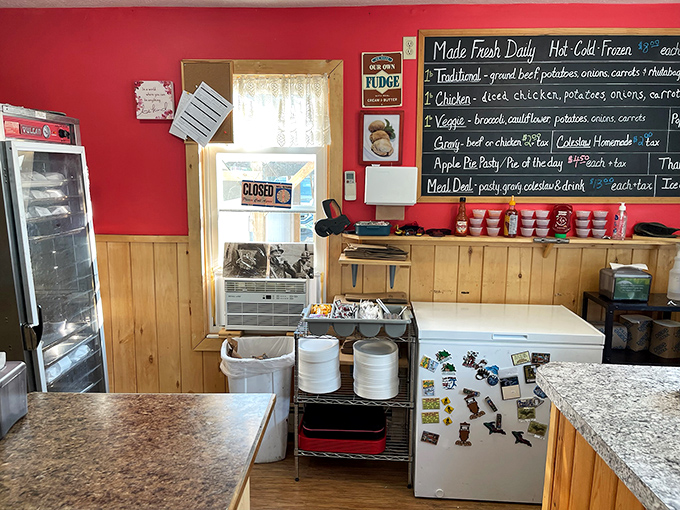 Behind the scenes in the kitchen area, where pasty magic happens daily. The red walls and wooden accents add warmth to this temple of Upper Peninsula cuisine.