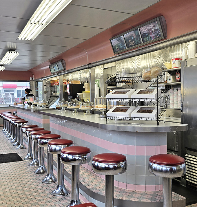 Counter seating: where solo diners become temporary family and the short-order ballet unfolds before your eyes. Pink and chrome never looked so inviting.