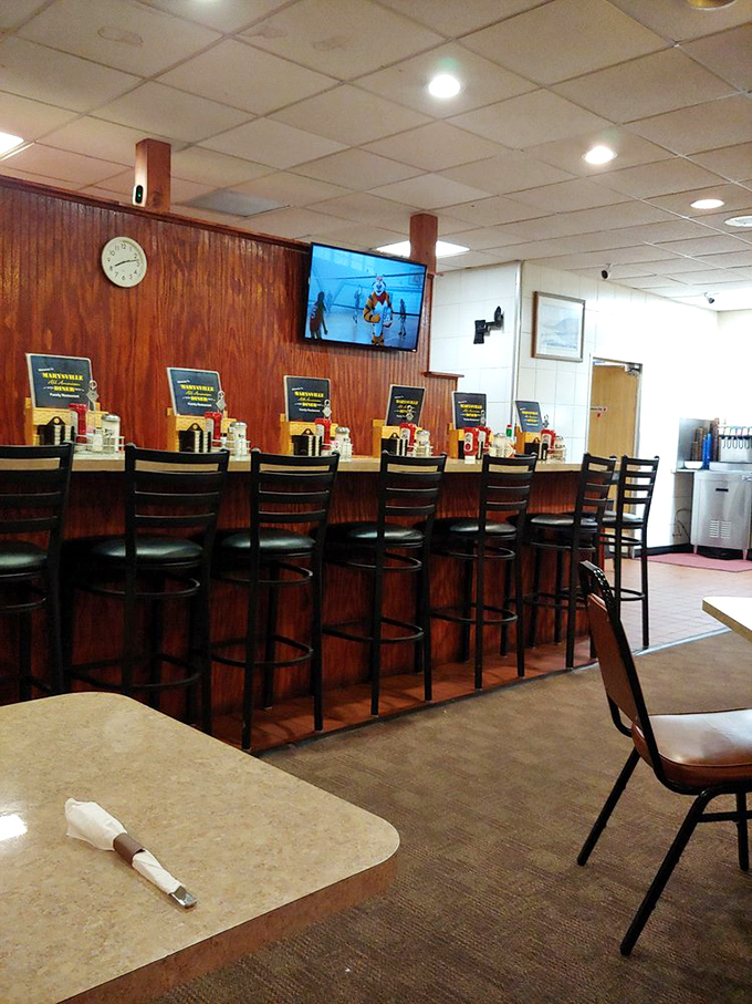 The counter seating&mdash;complete with swivel stools and wood paneling&mdash;offers front-row tickets to the short-order ballet performed daily by seasoned cooks.