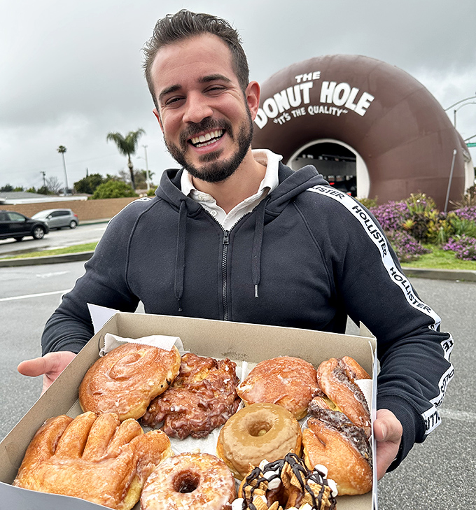 The universal language of donut joy. That smile says what we're all thinking: "I regret nothing about this delicious decision."