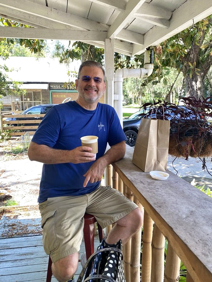 The universal language of coffee satisfaction knows no bounds. That paper bag promises treasures that will make the drive home seem much shorter.