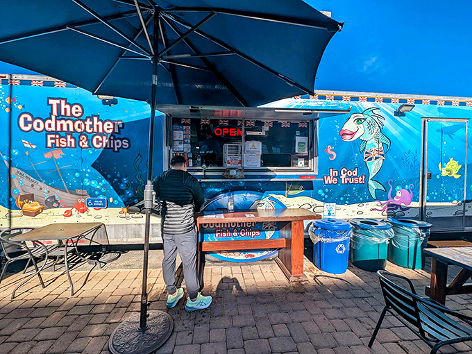 The anticipation builds as another convert joins the line, drawn by the siren song of frying fish.