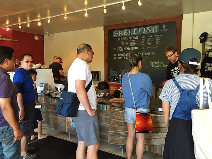 The universal language of anticipation: customers gathered at the counter, each awaiting their turn to point, order, and soon after, smile.