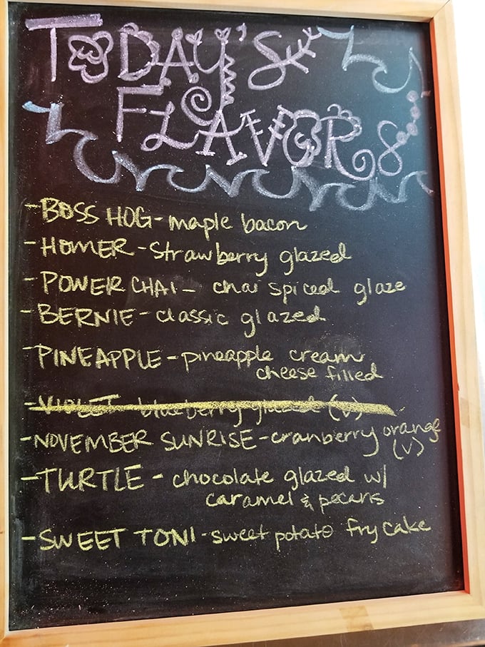 The chalkboard reveals today's flavor lineup, including "Boss Hog" maple bacon and "Sweet Toni" sweet potato fry cake. Donut poetry in motion.
