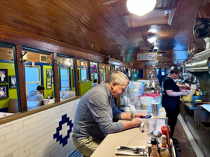 Counter seating: where solo diners become temporary family and the theater of short-order cooking unfolds better than any Broadway show.