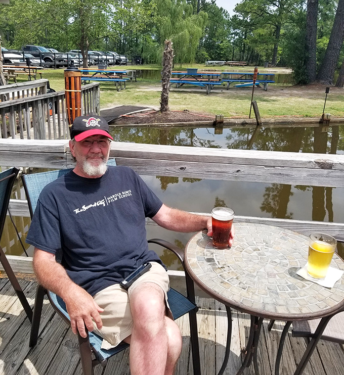 Nothing says "welcome friend" quite like a smiling regular enjoying the simple pleasure of good food outdoors.