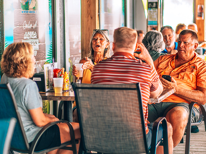The true measure of a local spot: tables filled with animated conversation, cold drinks, and the collective joy of good food shared.