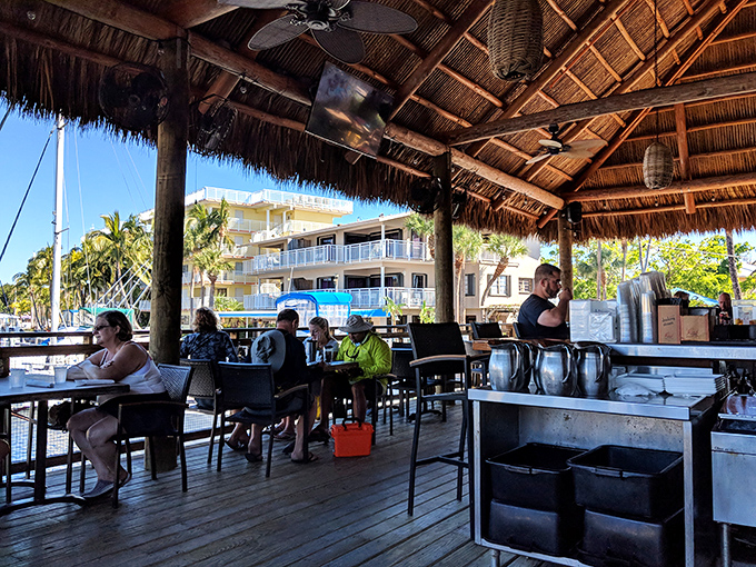 Under the thatched tiki roof, diners enjoy the quintessential Keys experience&mdash;cold drinks, ocean breezes, and the feeling that Monday is very far away.