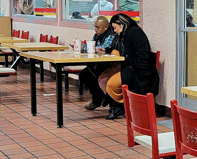 Real people enjoying real food. No influencer poses, just the universal body language of "this is really good."