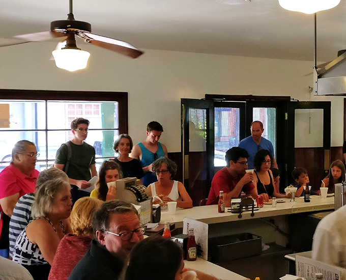 A full house at The Apple Pan isn't just customers&mdash;it's a community united by the universal language of "mmmmm." Notice how nobody's looking at their phones?