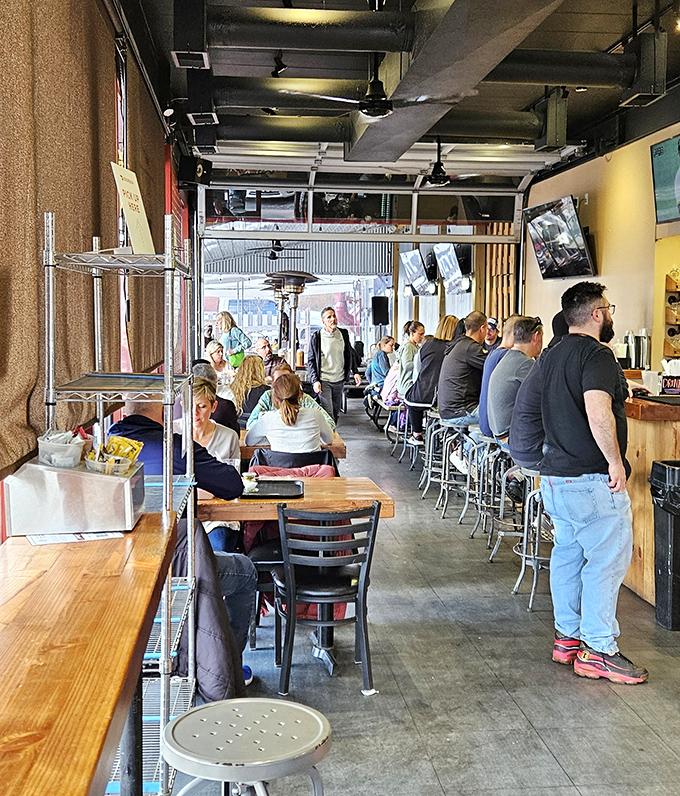 The universal language of contentment: folks gathered around good food, cold drinks, and the promise of seconds.