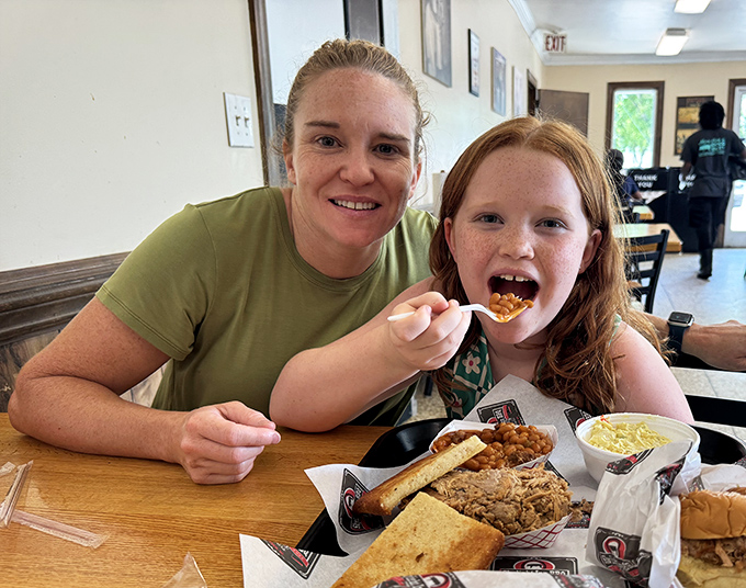 Barbecue brings families together. The joy on this young diner's face says everything about Skylight Inn's cross-generational appeal.