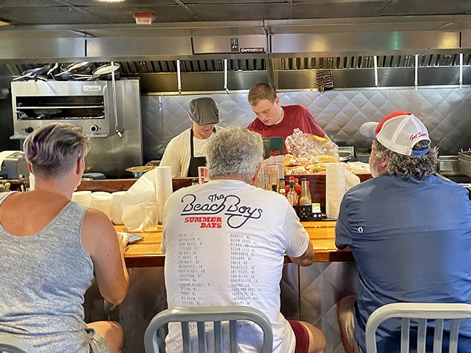 The counter seating at Big Sam's offers dinner and a show&mdash;watching skilled hands transform simple ingredients into coastal magic is better than anything on Netflix.