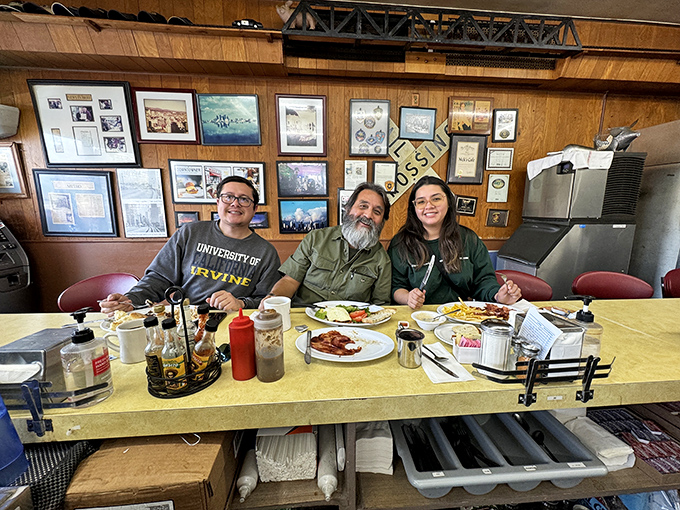 Happy diners sharing a moment of breakfast bliss. In a world of Instagram food that's better photographed than eaten, these smiles tell the real story.