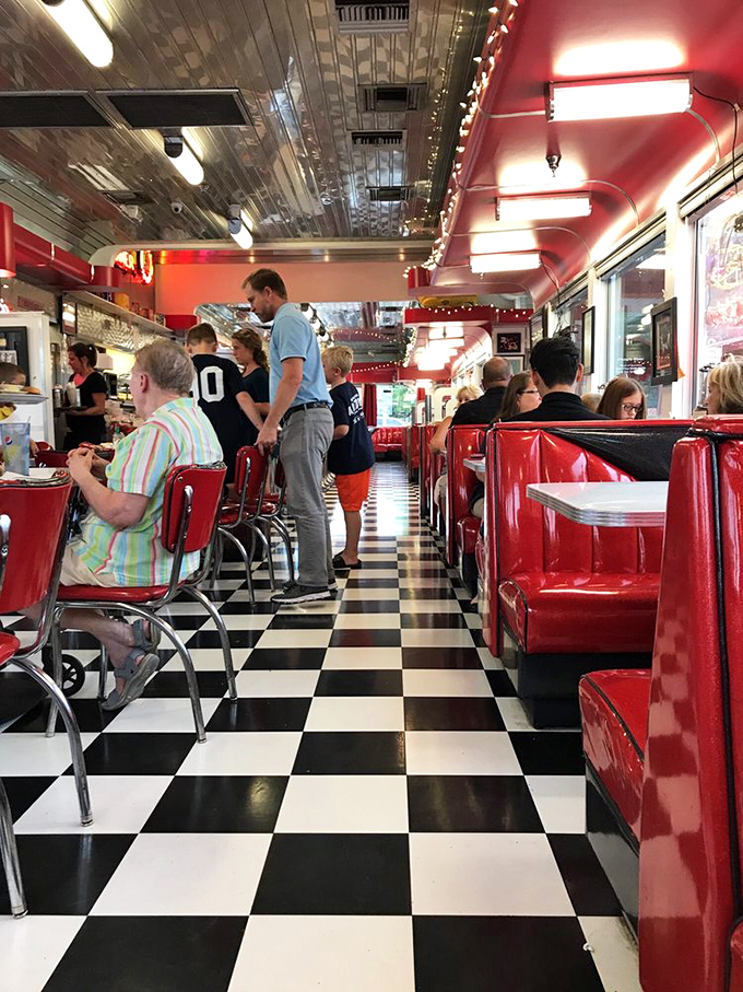 Chrome stools line the counter where solo diners can watch the kitchen magic happen up close.