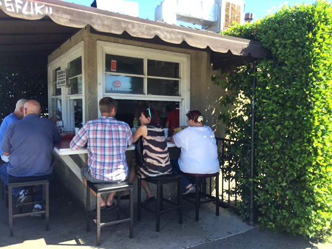 The counter seating puts you front-row center to the burger show, where strangers become temporary friends united by good taste.