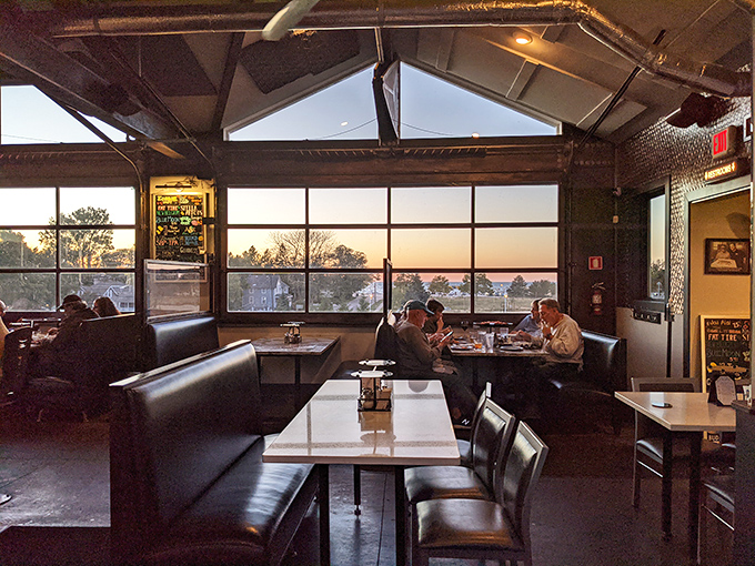 Sunset views through panoramic windows&mdash;because great pizza deserves a backdrop worthy of its flavor profile.