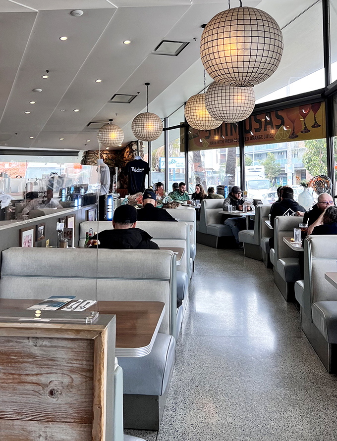 Those globe pendant lights cast the kind of glow that makes everyone look like they're in a nostalgic indie film about finding themselves.