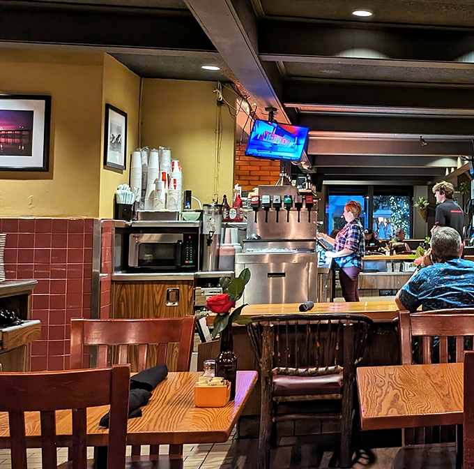 Where wooden tables meet warm lighting, conversations flow as freely as the coffee. Some of life's best moments happen in corners like these.