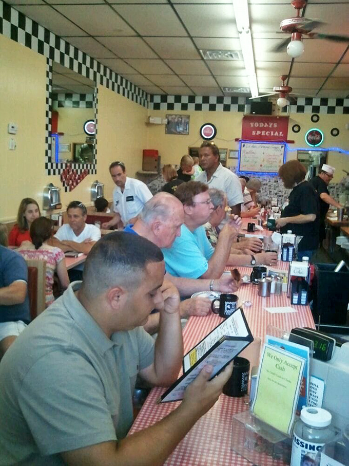 A packed house where strangers become friends over shared appreciation for exceptional comfort food.