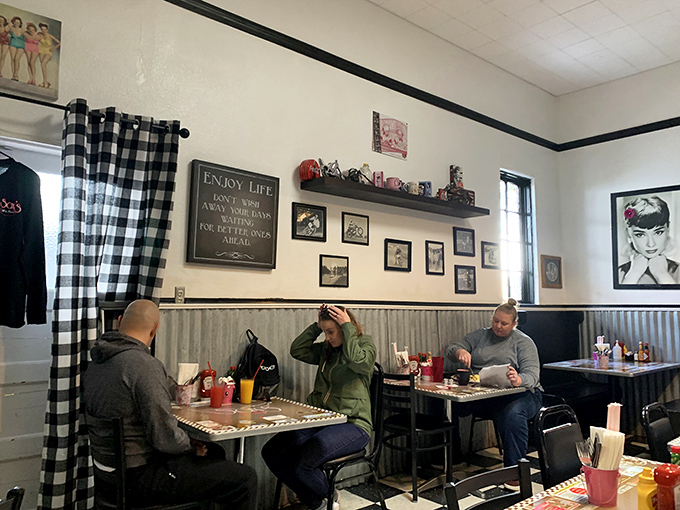 Where strangers become temporary breakfast companions, bonding over coffee and the shared anticipation of plates piled high with morning delights.