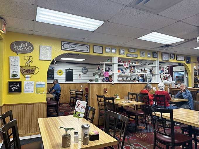 Cheerful yellow walls adorned with coffee-themed signs create the backdrop for what matters most &ndash; locals enjoying their breakfast favorites.
