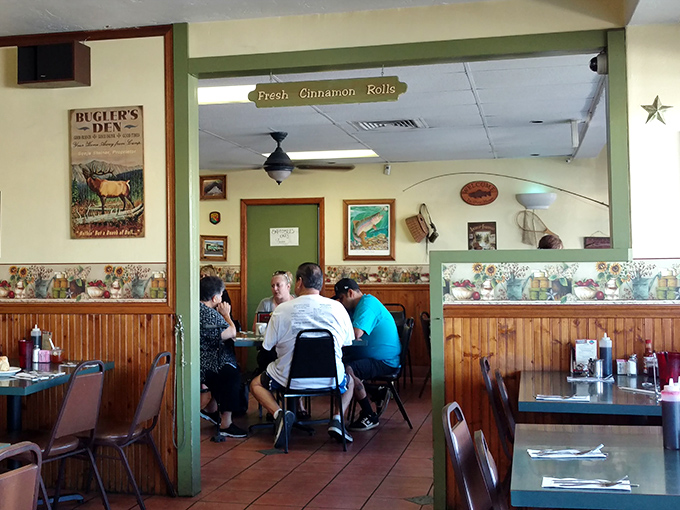 Under the "Fresh Cinnamon Rolls" sign, life-changing decisions are made daily. These diners have clearly made the right one.