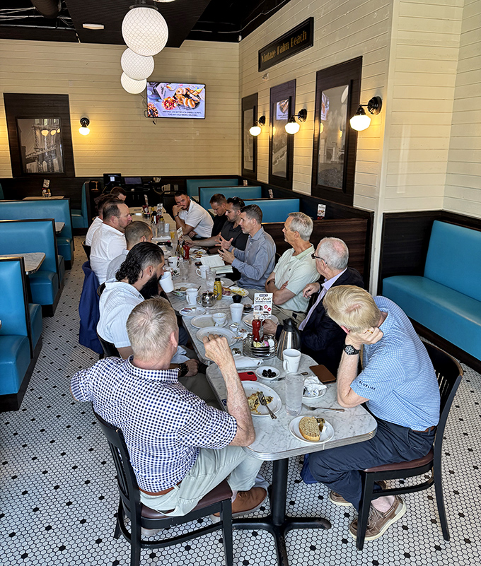 A gathering around TooJay's tables isn't just a meal&mdash;it's a summit of sandwich enthusiasts plotting their next move in the game of delicious decisions.