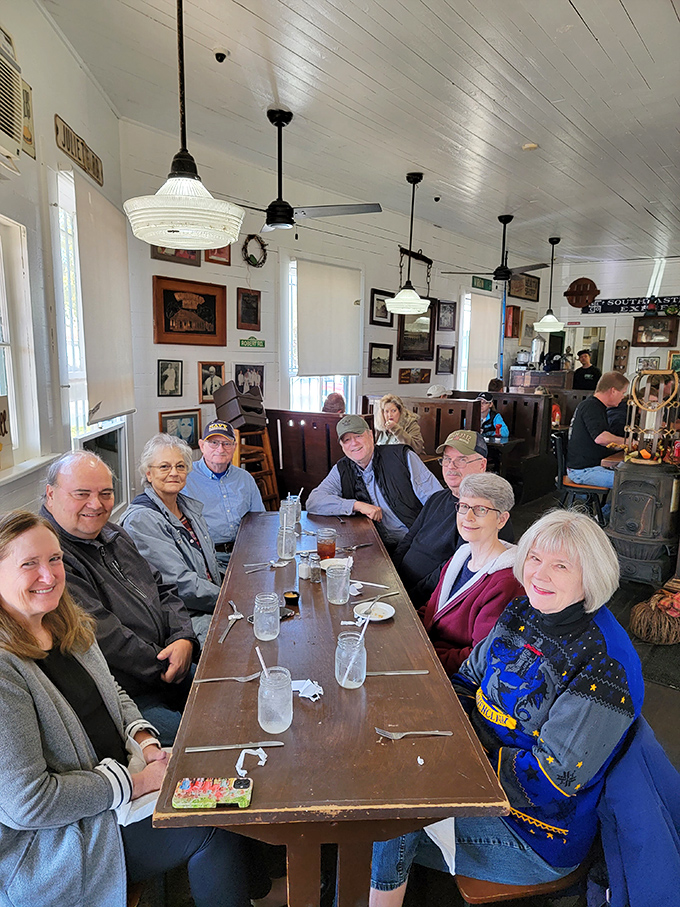 The communal table isn't just furniture&mdash;it's where strangers become friends over sweet tea and shared stories. Southern dining at its most authentic.