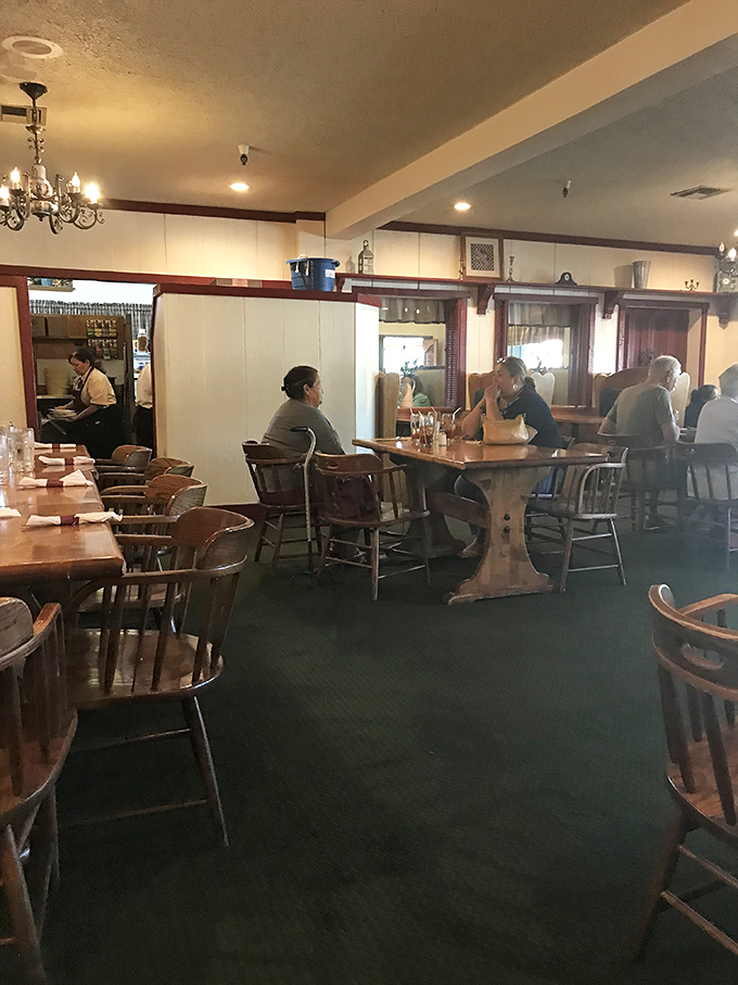 Where locals gather to debate important matters like whether to start with salad (for health) or head straight for the fried chicken (for happiness).