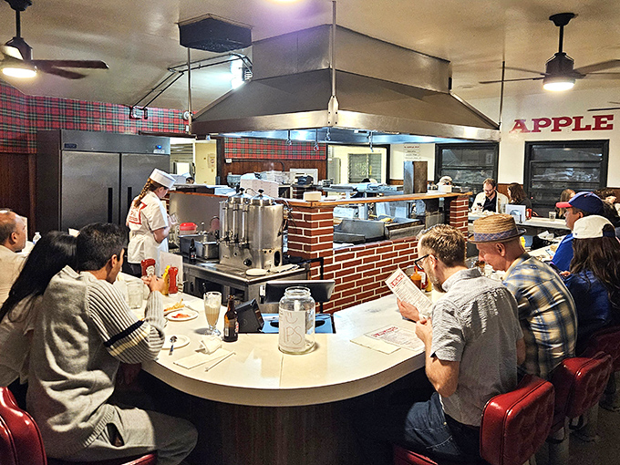 Strangers become temporary companions at The Apple Pan's counter, united by the universal language of "mmm" and "you've got to try this."