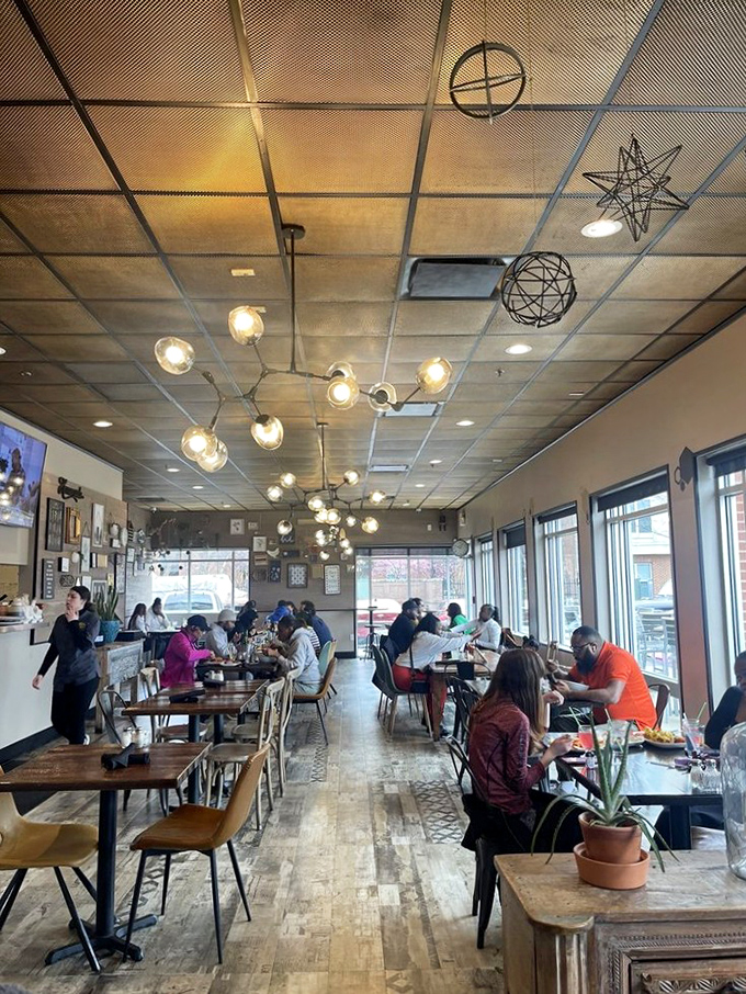 A bustling dining room where strangers become friends over shared "oh my god you have to try this" moments. The chandelier watches approvingly.
