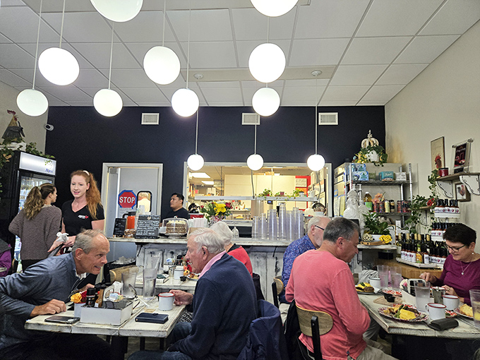 Morning conversations flow as freely as the coffee in this bustling dining room where Naples locals start their day right.