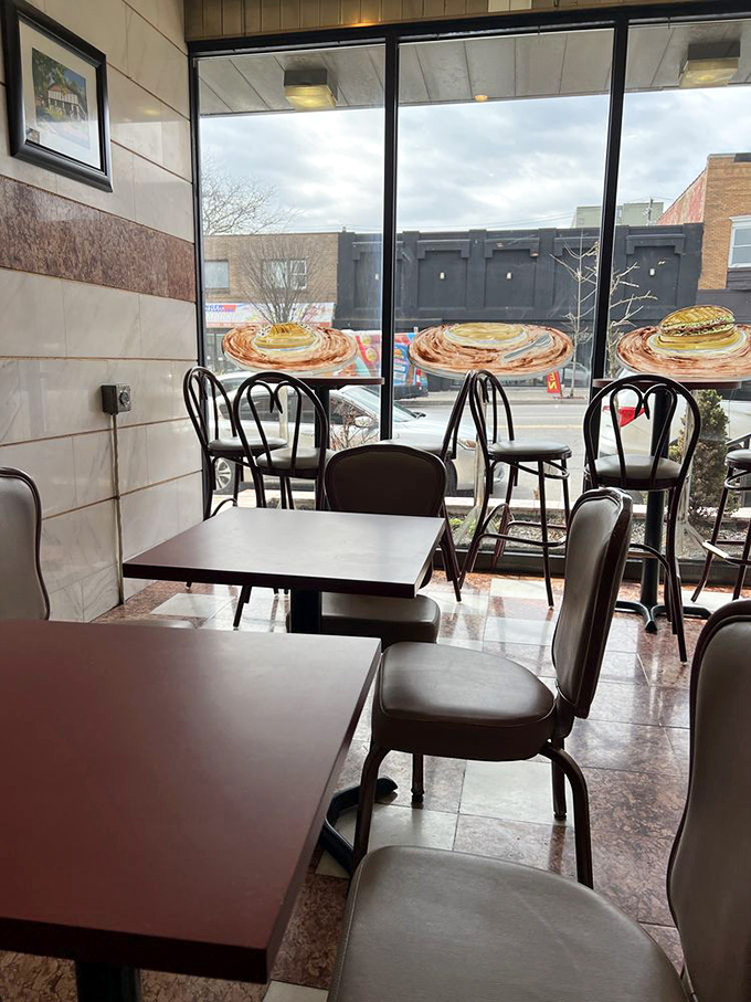 A dining area bathed in natural light, where sandwiches are savored and life decisions are contemplated. The window seats offer prime people-watching real estate.