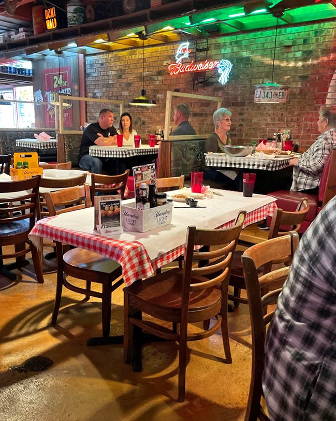 The dining area hums with conversation and clinking glasses&mdash;a symphony of satisfaction conducted under the glow of neon beer signs.