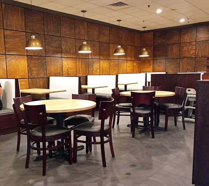 The dining area's rich wood paneling and pendant lighting create an atmosphere that says, "Yes, this is a buffet, but one where you might actually want to linger."