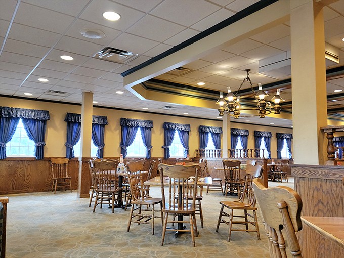 Blue curtains, wooden dividers, and chandeliers create that "fancy but not fancy-fancy" vibe that makes comfort food taste even better.