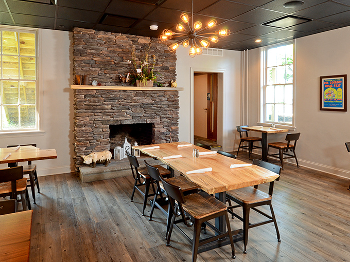 A stone fireplace anchors the dining room, creating the perfect backdrop for the serious business of BBQ appreciation &ndash; like Thanksgiving at your coolest relative's house.