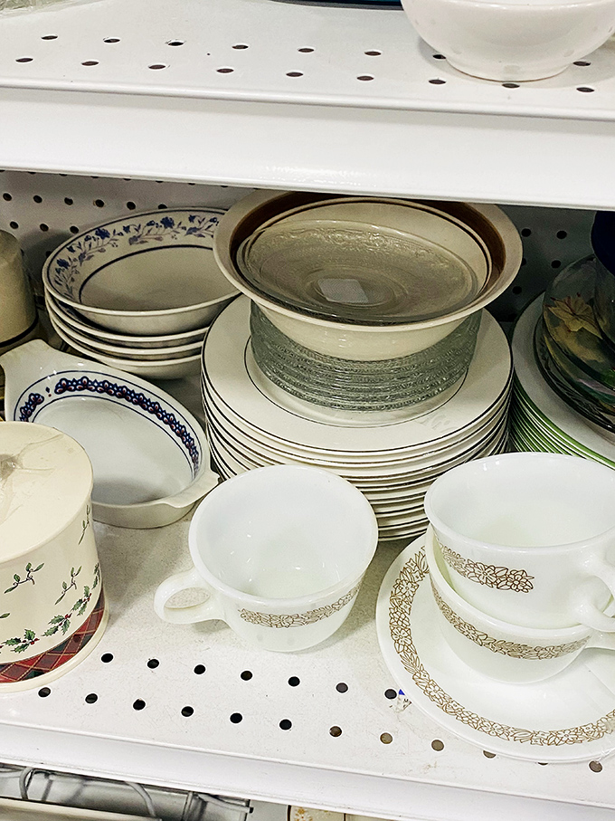 Dining room diplomacy unfolds in ceramic and glass, where mismatched place settings create perfectly imperfect table stories.