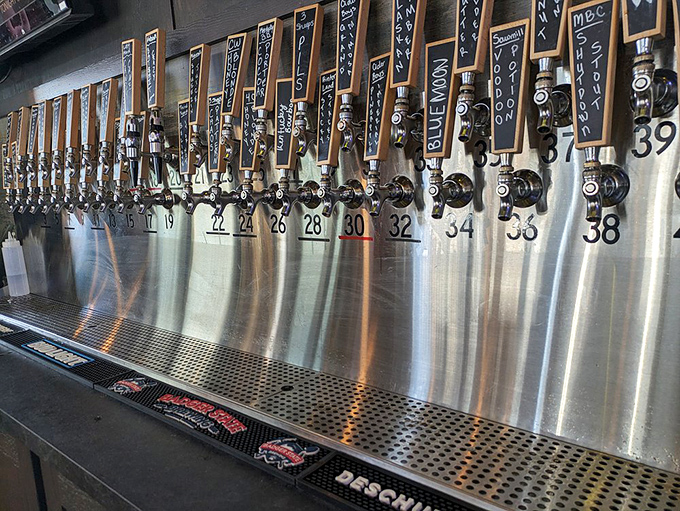 Beer taps lined up like soldiers ready for duty. Each handle promises a different adventure for your taste buds.