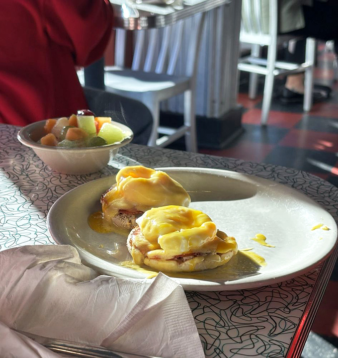 Eggs Benedict done right&mdash;with hollandaise sauce cascading down like a yellow waterfall of buttery goodness.