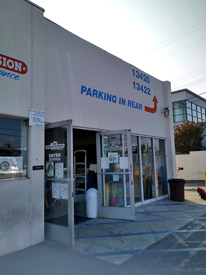 Enter/Entrada promises bilingual bargains inside. The modest entrance conceals a warehouse of wonders waiting to be discovered.