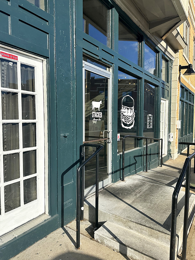 The entrance beckons with promises of burger bliss, its green doors like portals to a more delicious dimension.