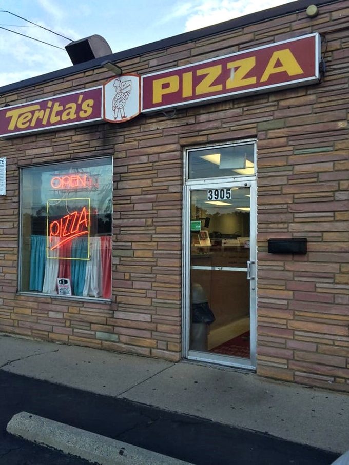Another exterior view of this Columbus institution, where the neon "PIZZA" sign tells you everything you need to know about priorities.
