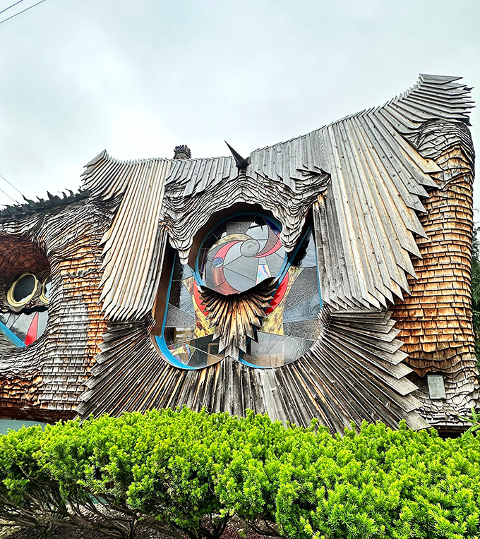 Shingles cascade like dragon scales, turning the exterior into a three-dimensional sculpture you can actually enter.