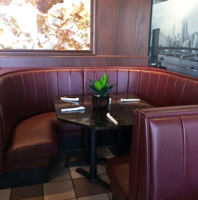 The corner booth&mdash;diner real estate at its finest. That marble-topped table has probably witnessed more heart-to-hearts than a therapist's couch.