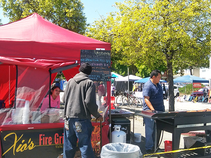 The aroma of grilled delights wafts through the market, where hungry shoppers refuel between bargain hunts at local food stands.