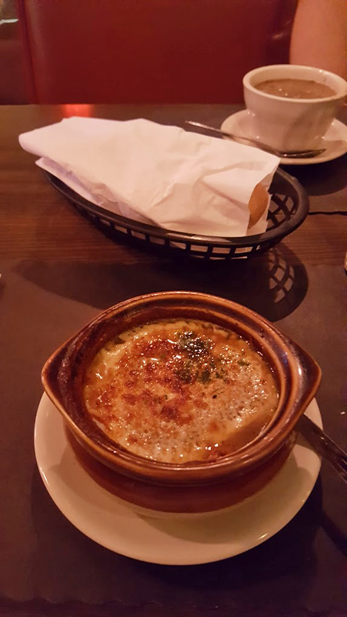 French onion soup: where gooey cheese meets savory broth in perfect harmony. The ultimate cold-weather companion that never disappoints.