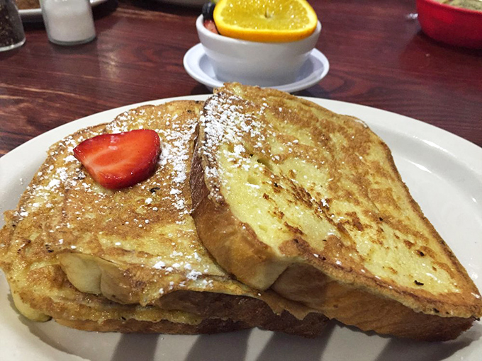 French toast that's dressed for success. Golden, crisp, and ready for its close-up with a strawberry beret.