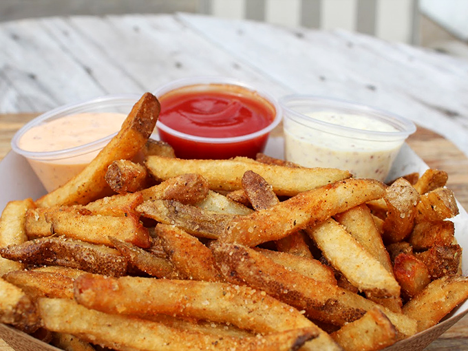 Perfectly crisp fries with dipping sauces standing by. The supporting actors in this seafood drama deserve their own standing ovation.